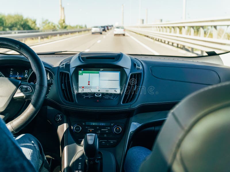 Dashboard View and GPS Map of Modern Car with Hands of Driver on ...