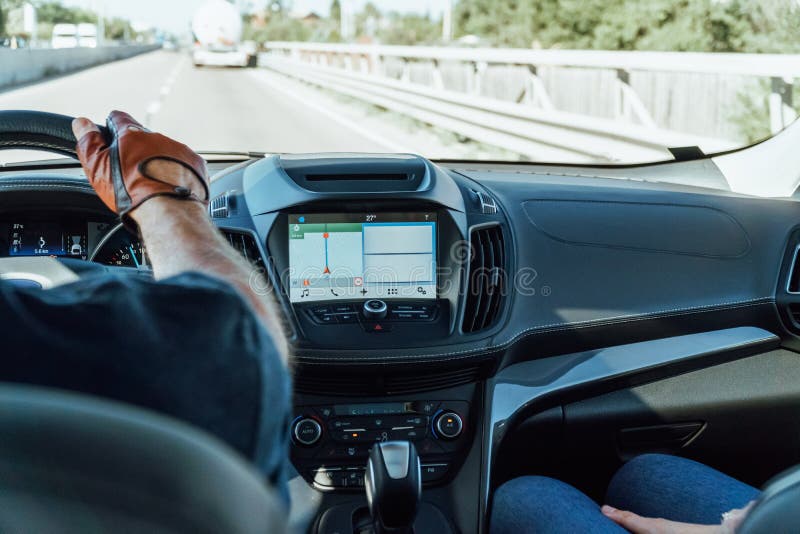 Dashboard View and GPS Map of Modern Car with Hands of Driver on ...
