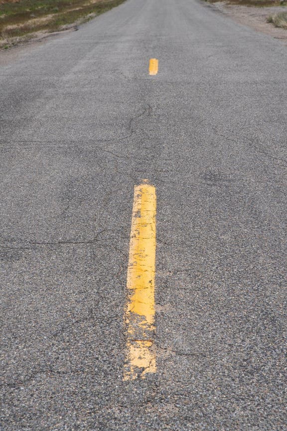 Dashed Yellow Line on Rough Road Stock Image - Image of country, line ...