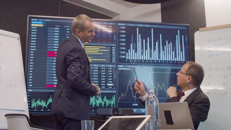 Data Analyst Presenting Business Statistics To Boss in Office Stock ...