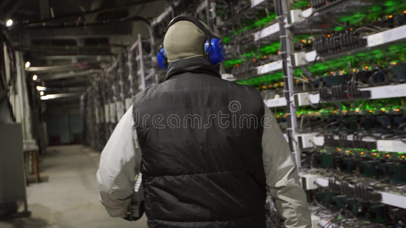 Data Center Engineer Greeting Colleague, Examining System Diagnostics ... Data Center Engineer Greeting Colleague, Examining System Diagnostics ...