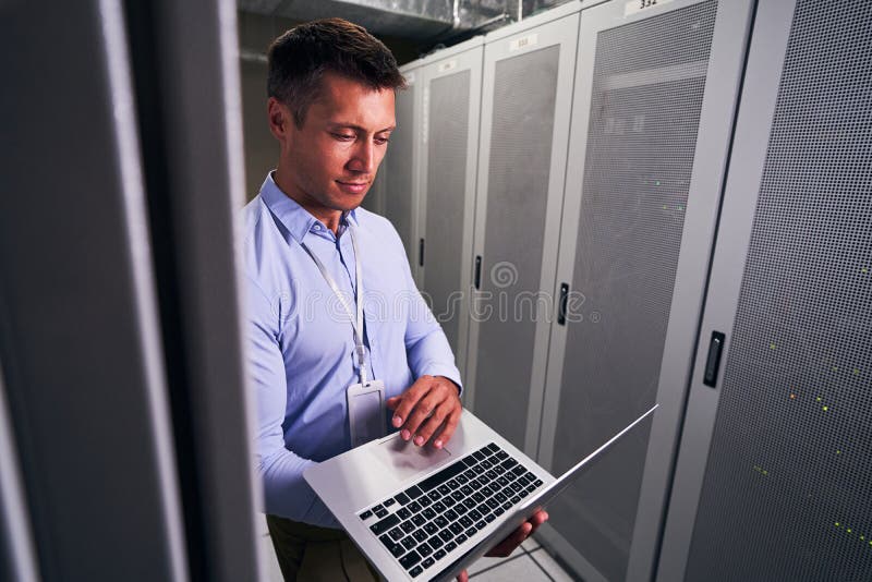 Data Center Employee Using His Notebook Computer Stock Image - Image of ...