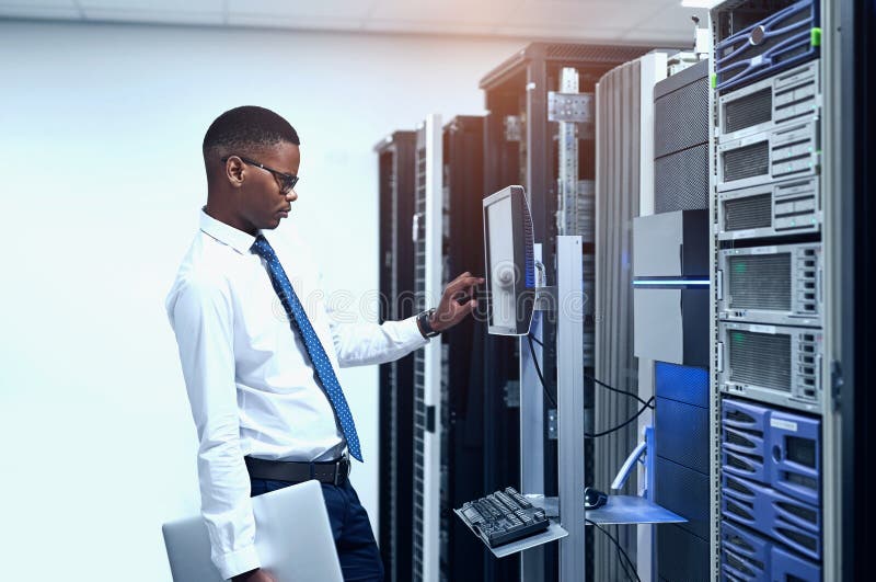 Data Center, Engineer and Black Man with Pc in Server Room for ...