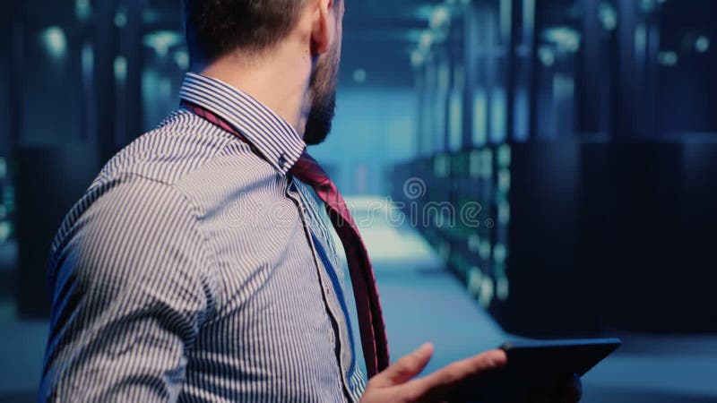 Data Center it Engineer Standing Next To Server Cabinets Stock Video ...