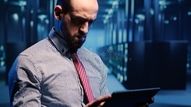 Data Center it Engineer Standing Next To Server Cabinets Stock Photo ...