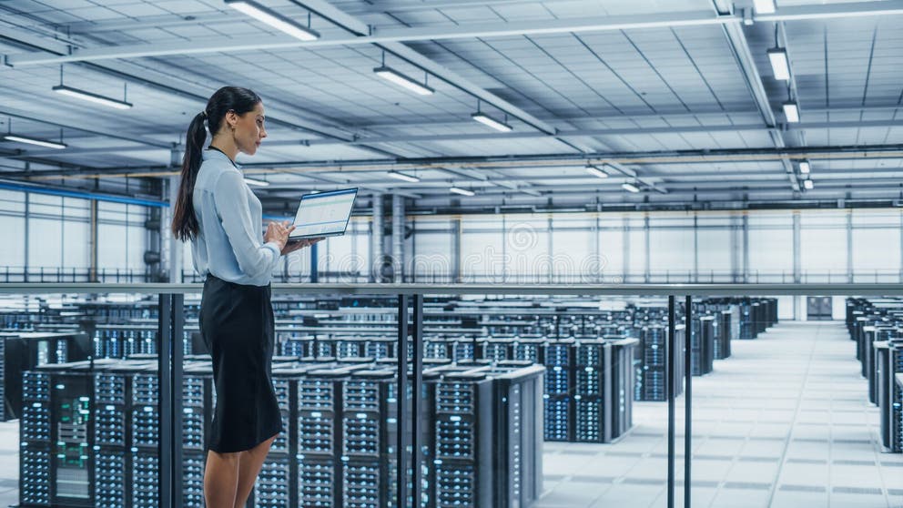 Data Center Engineer Using Laptop Computer. Server Farm Cloud Computing ...