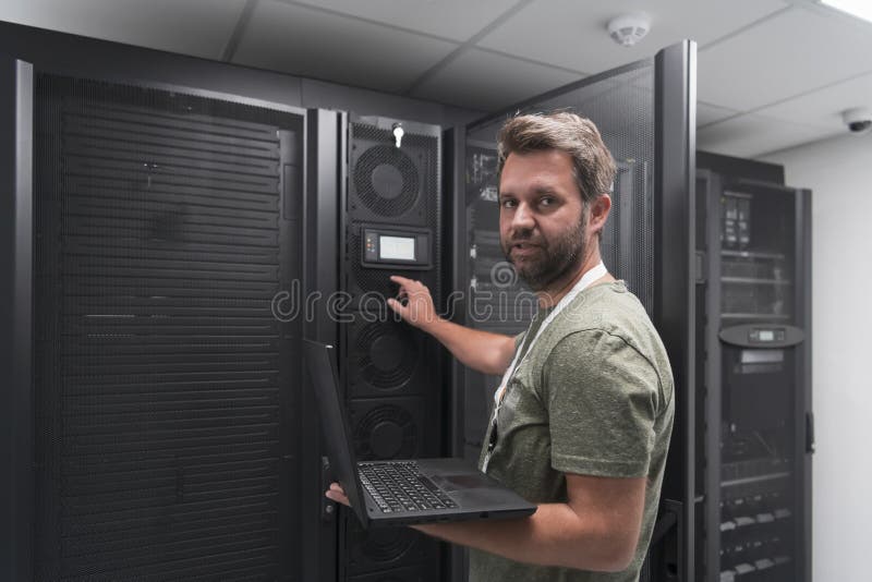 Data Center Engineer Using Laptop Computer Server Room Specialist ...