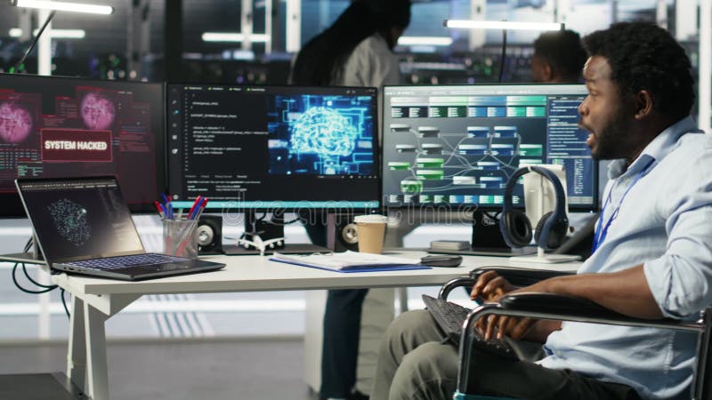 Data Center Engineer in Wheelchair and Coworkers Fighting Security ...