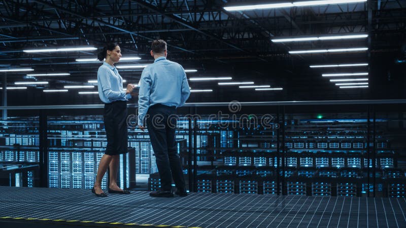 Data Center Female System Administrator and Male it Specialist Talk ...