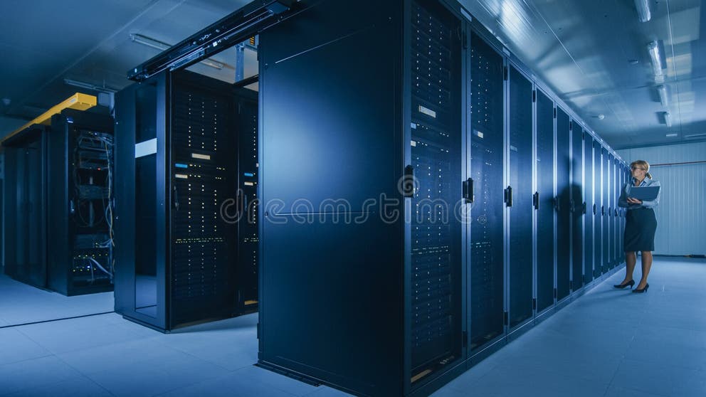 In Data Center: Female it Technician Running Maintenance Programme on a ...