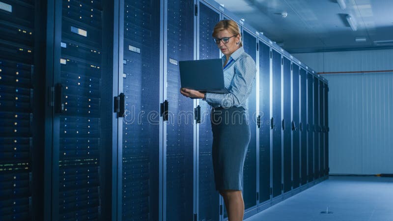 In Data Center: Female it Technician Running Maintenance Programme on a ...