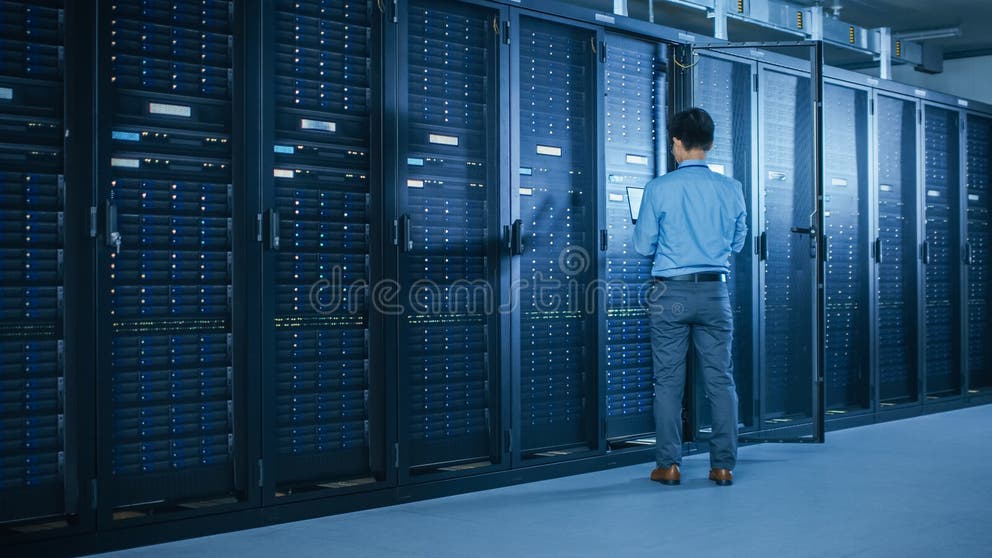 In Data Center: Male it Technician Running Maintenance Programme on a ...
