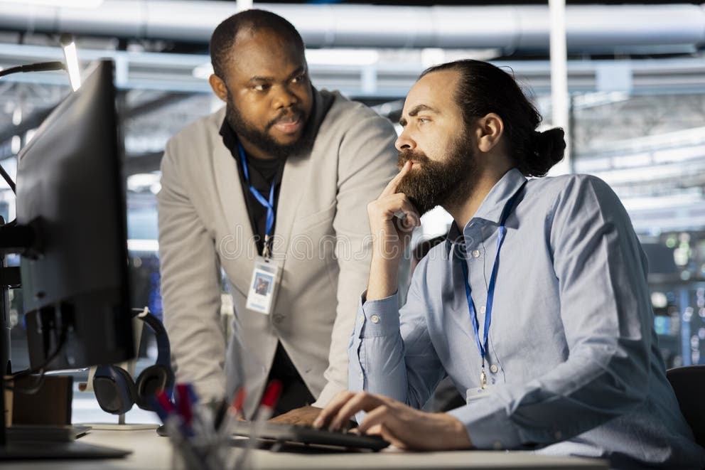 Data Center Manager Supervising Work Done by Employee Verifying ...