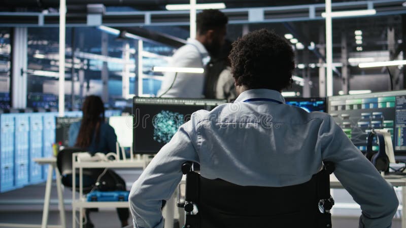 Data Center Programmer in Wheelchair Entering Office Uses AI Node Tree Program Stock Video ...