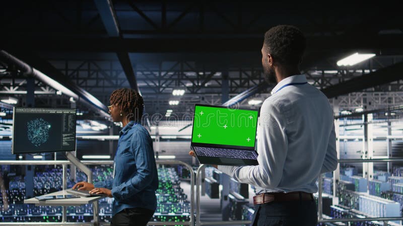 Technicians Data Center Using Green Screen Mockup Laptop Stock Photos ...