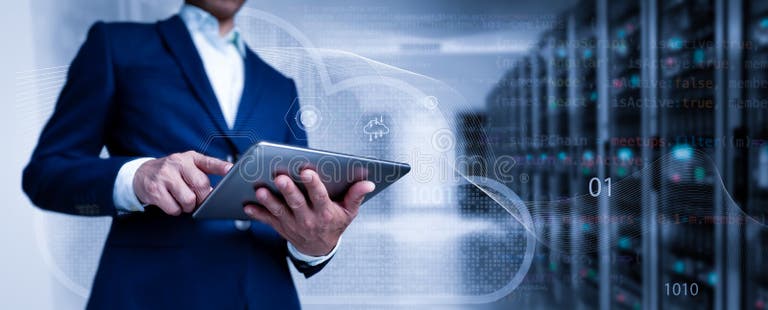 In a Data Center or Server Room, a Computer Programmer Works on Big ...