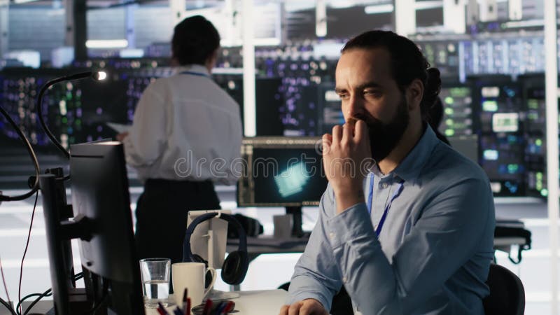 Data Center Technician Discussing with Coworker in Workspace Stock ...