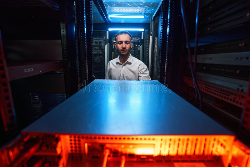 Data Center Worker Doing Maintenance of Computer Equipment Stock Photo ...