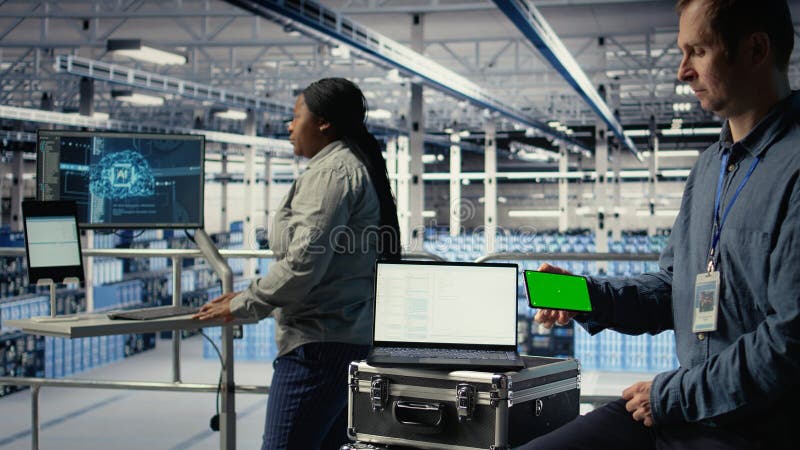 Data Center Worker Uses Isolated Screen Smartphone while Deploying Deep Learning Stock Image ...