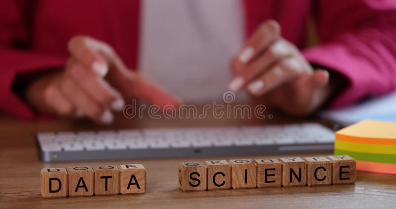 Data Science Words on Cubes and Woman Working with Data on Computer ...