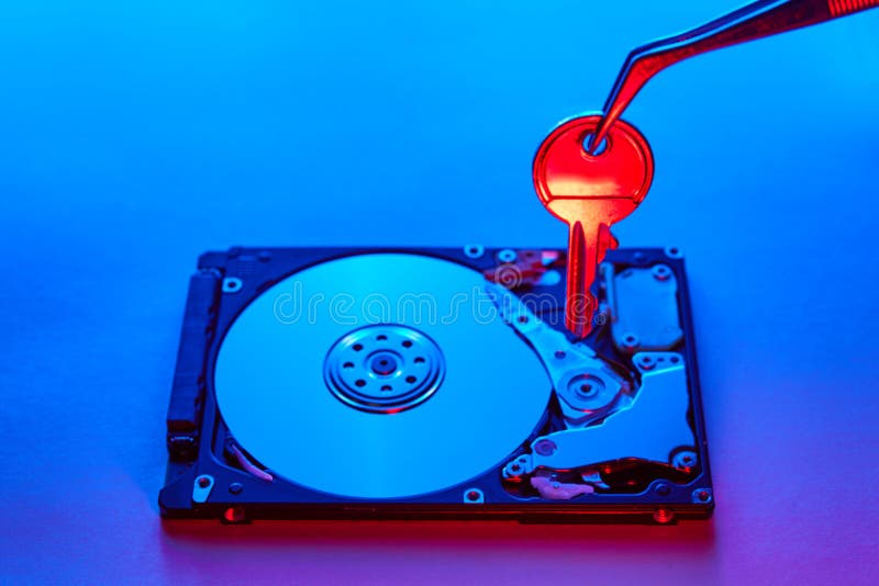 Data Security Concept. Key on Spindle of a Hard Disk Drive. Opened Hard ...