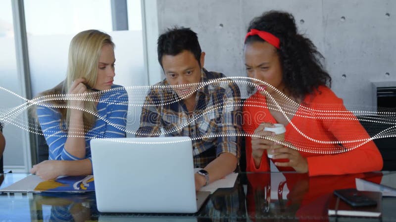 Data Wave Animation Over Diverse Colleagues Collaborating on Laptop in ...