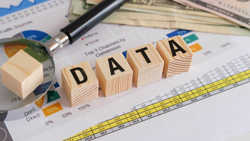 Data is a Word that is Written on a Piece of Paper with a Magnifying ...