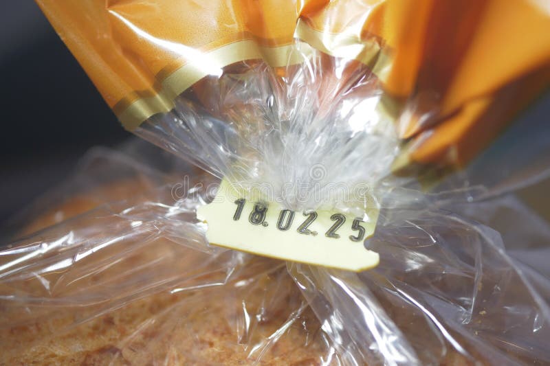 Date Marked on a Packaged Loaf of Bread in Plastic Wrap Stock Image ...