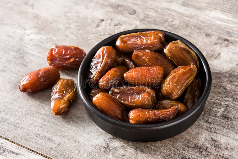 Dates in Black Bowl on Wood Stock Image - Image of black, turkey: 145123649