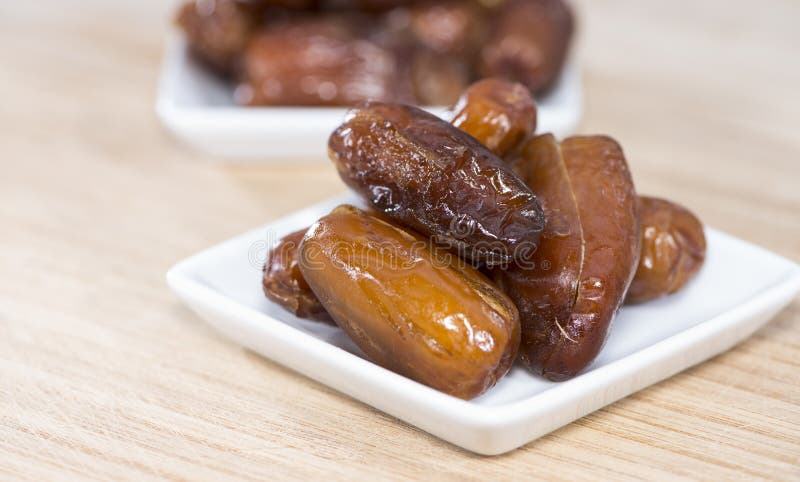 Dates in a bowl stock photo. Image of fresh, brown, cuisine - 40100270