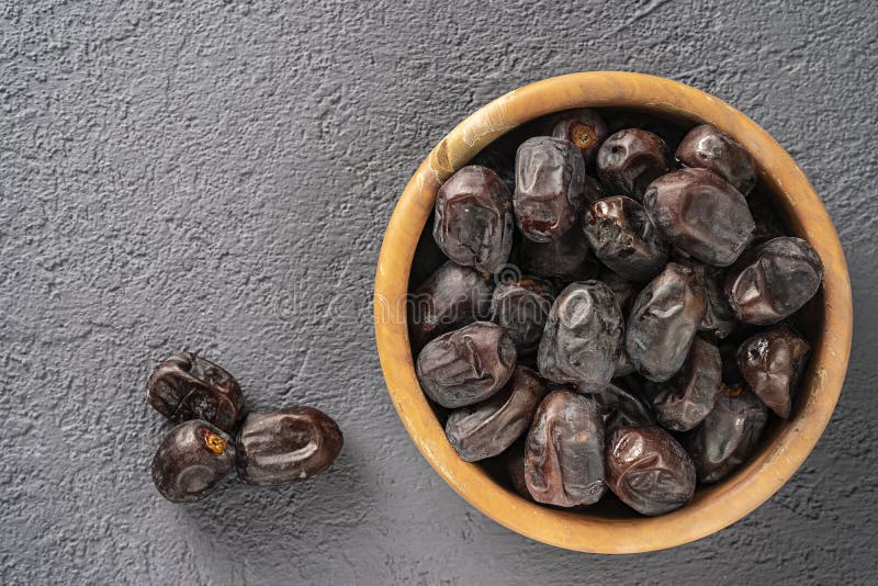 Dates Fresh Fruit in a Wooden Plate, Top View. Space for the Text Stock ...