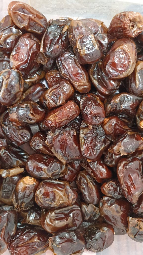 Dates in a plastic box stock photo. Image of fruit, snack - 311785494