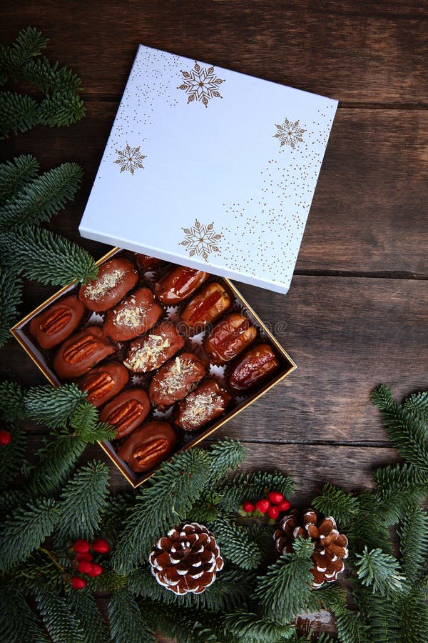 Dates in White Box. Box with Dates and Branches of Christmas Tree ...