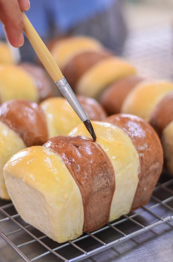 Daubing Butter To Baked Bun for Shine Its Surface Stock Photo - Image ...