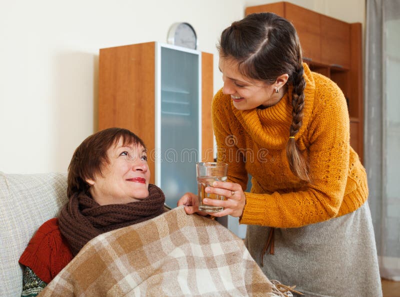 Mother Cold Greeting Her Young Daughter Stock Photo - Image of door ...