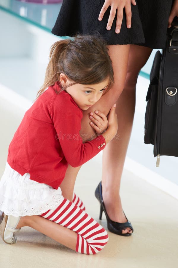 Daughter Clinging To Mother S Leg Stock Photo - Image of briefcase ...