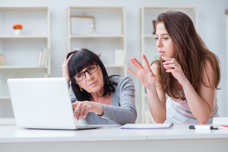 The Daughter Explaining To Mom How To Use Computer Stock Image - Image ...