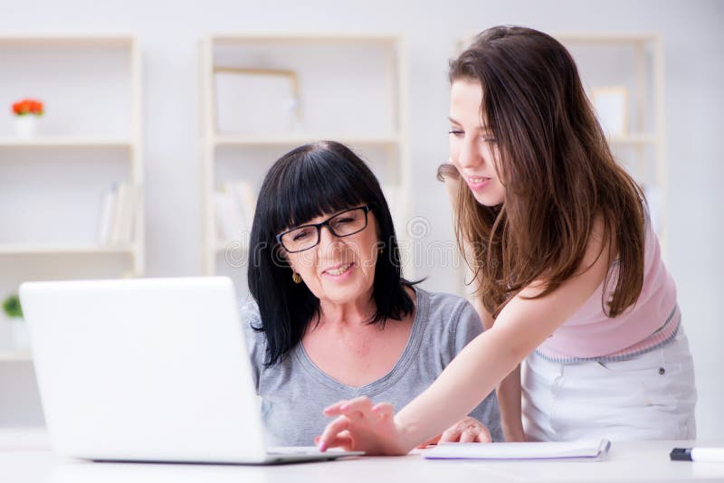 The Daughter Explaining To Mom How To Use Computer Stock Photo - Image ...