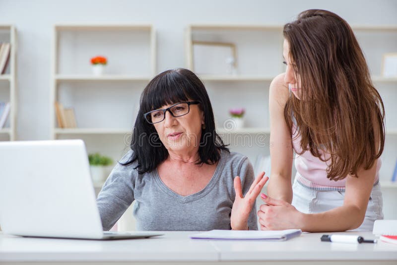 The Daughter Explaining To Mom How To Use Computer Stock Photo - Image ...