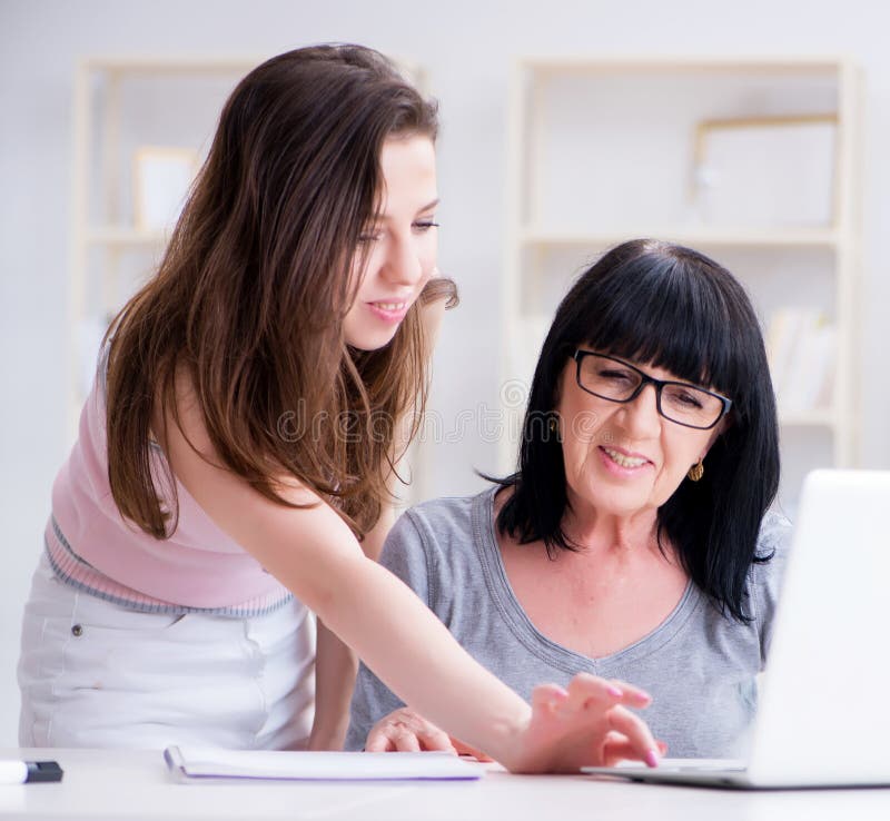 Daughter Explaining To Mom How To Use Computer Stock Image - Image of ...