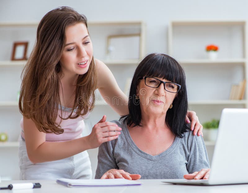 Daughter Explaining To Mom How To Use Computer Stock Photo - Image of ...