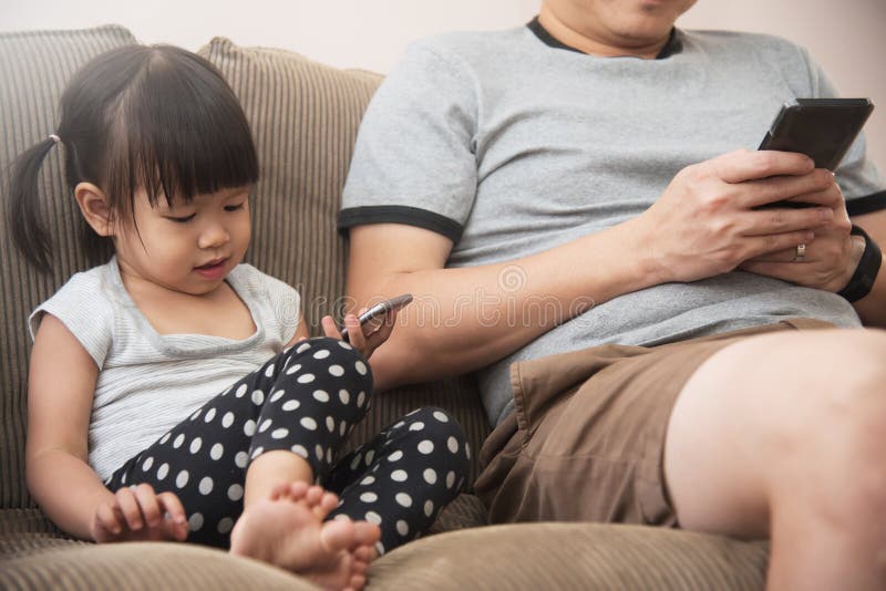 Daughter and Father Using Cell Phone. Stock Photo - Image of mother ...