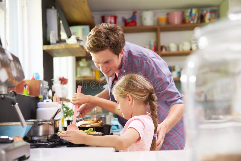 Father and Children Sorting Laundry in Kitchen Stock Image - Image of ...