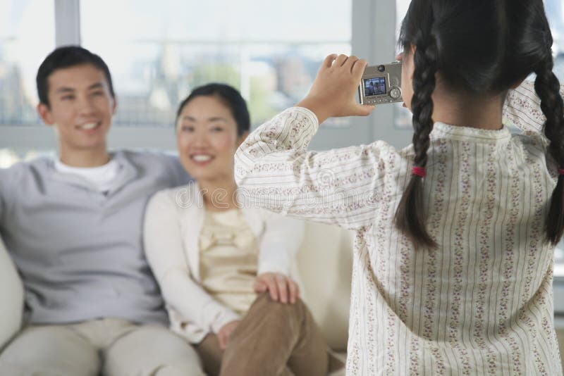 Daughter Taking Picture of Parents Stock Image - Image of elementary ...