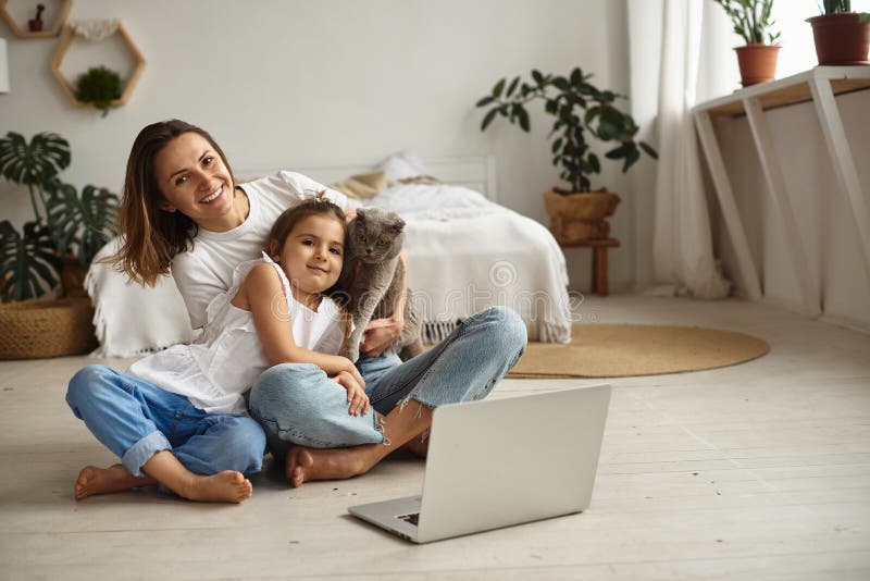 Daughter Watching Mom Work on Computer Stock Image - Image of business ...