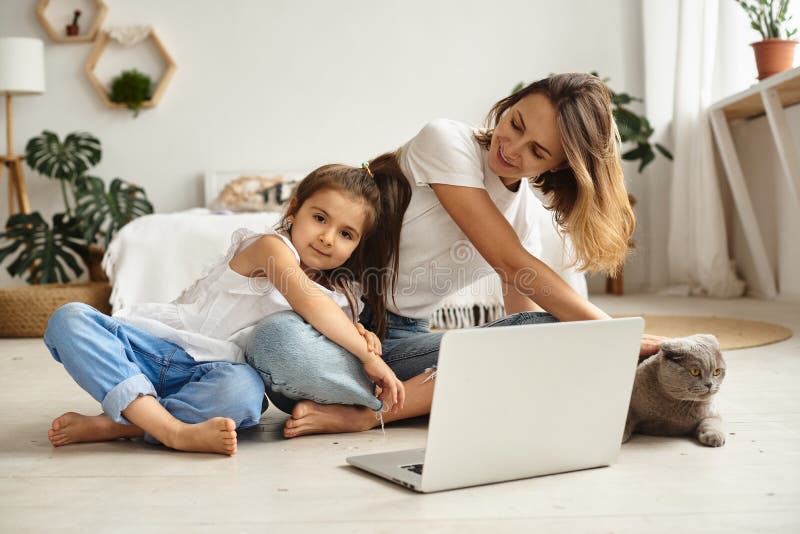 Daughter Watching Mom Work on Computer Stock Image - Image of adult ...