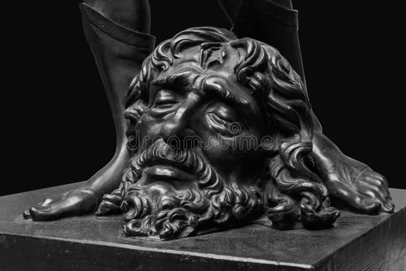 David Legs with the Head of Goliath Statue on Black Stock Photo - Image ...