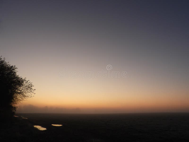 Dawn Light Breaks through the Early Morning Frosty Fog Stock Image ...