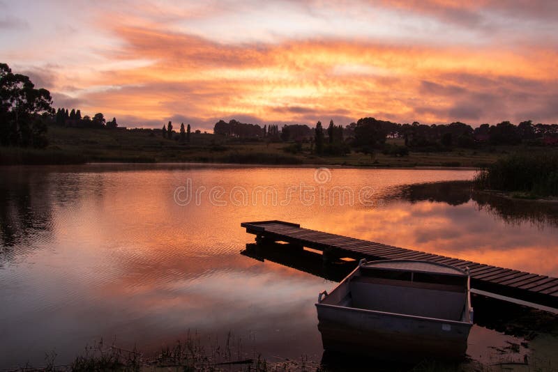 Sunrise Over an Inland Fresh Water Lake Stock Image - Image of rays ...