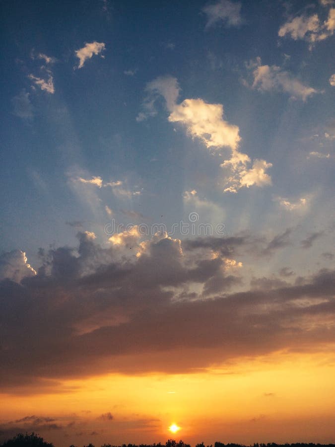 Dawn Clouds Sun and Blue Orange Sky Stock Photo - Image of clouds, blue ...
